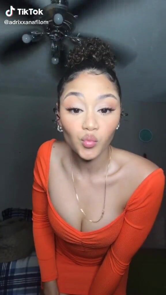 Sexy Adriana Shows Cleavage In Orange Dress