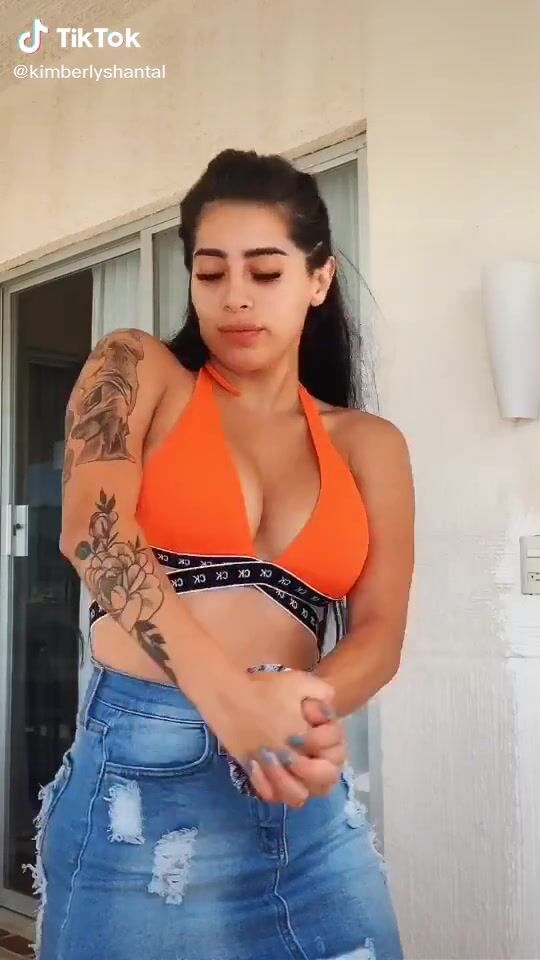 Fine Kim Shantal Shows Cleavage in Sweet Orange Crop Top | sexyfilter.com