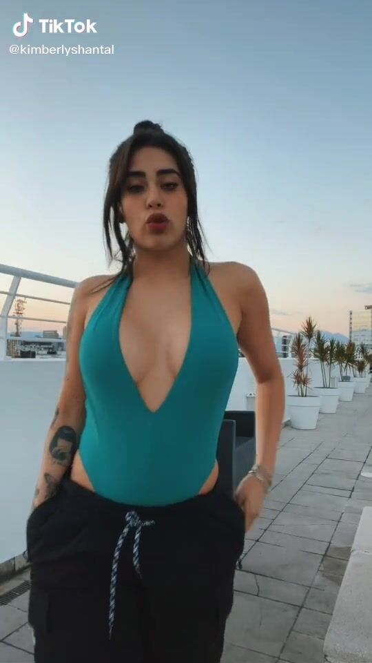 Hot Kim Shantal Shows Cleavage in Green Swimsuit | sexyfilter.com